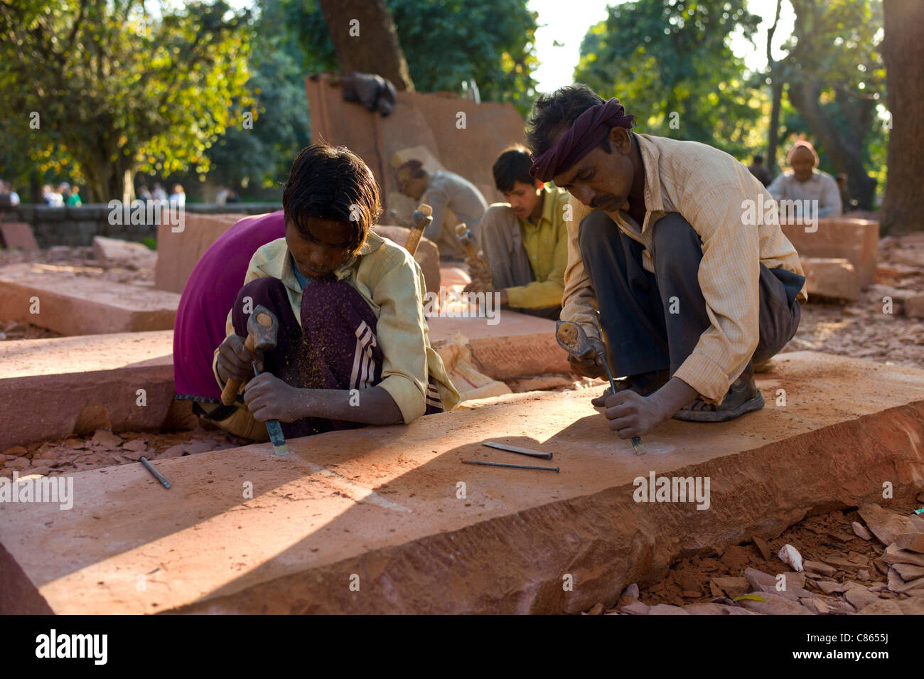 Stonemasons using traditional manual skills at stone workshop at ...