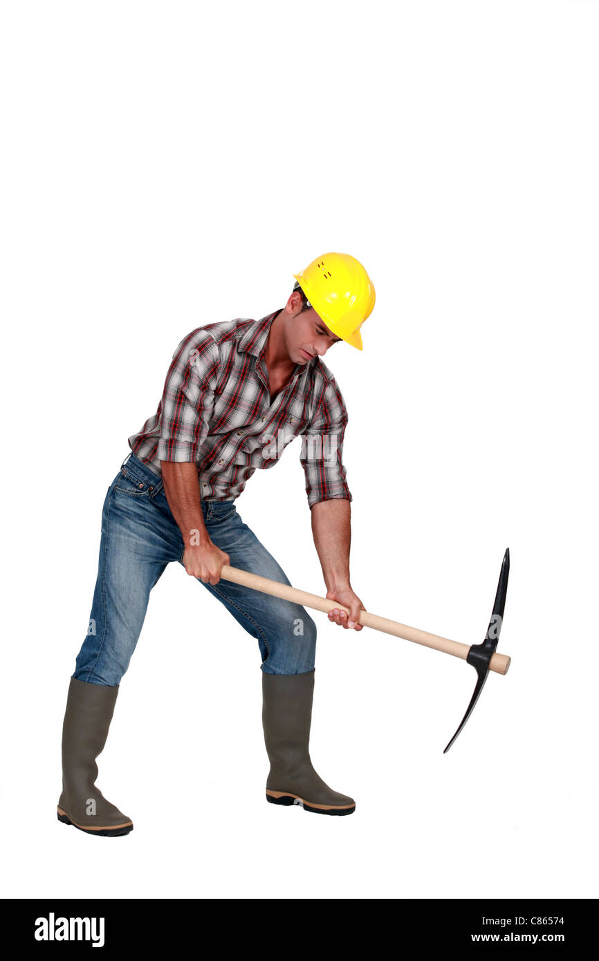 Man with a pickaxe Stock Photo - Alamy