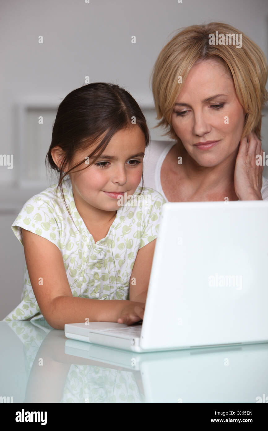 mother and daughter with computer Stock Photo - Alamy