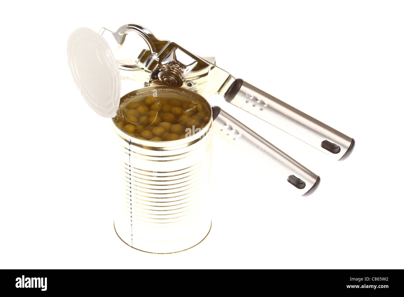 Tin opener opening a can of food canned, tinned peas isolated on white ...