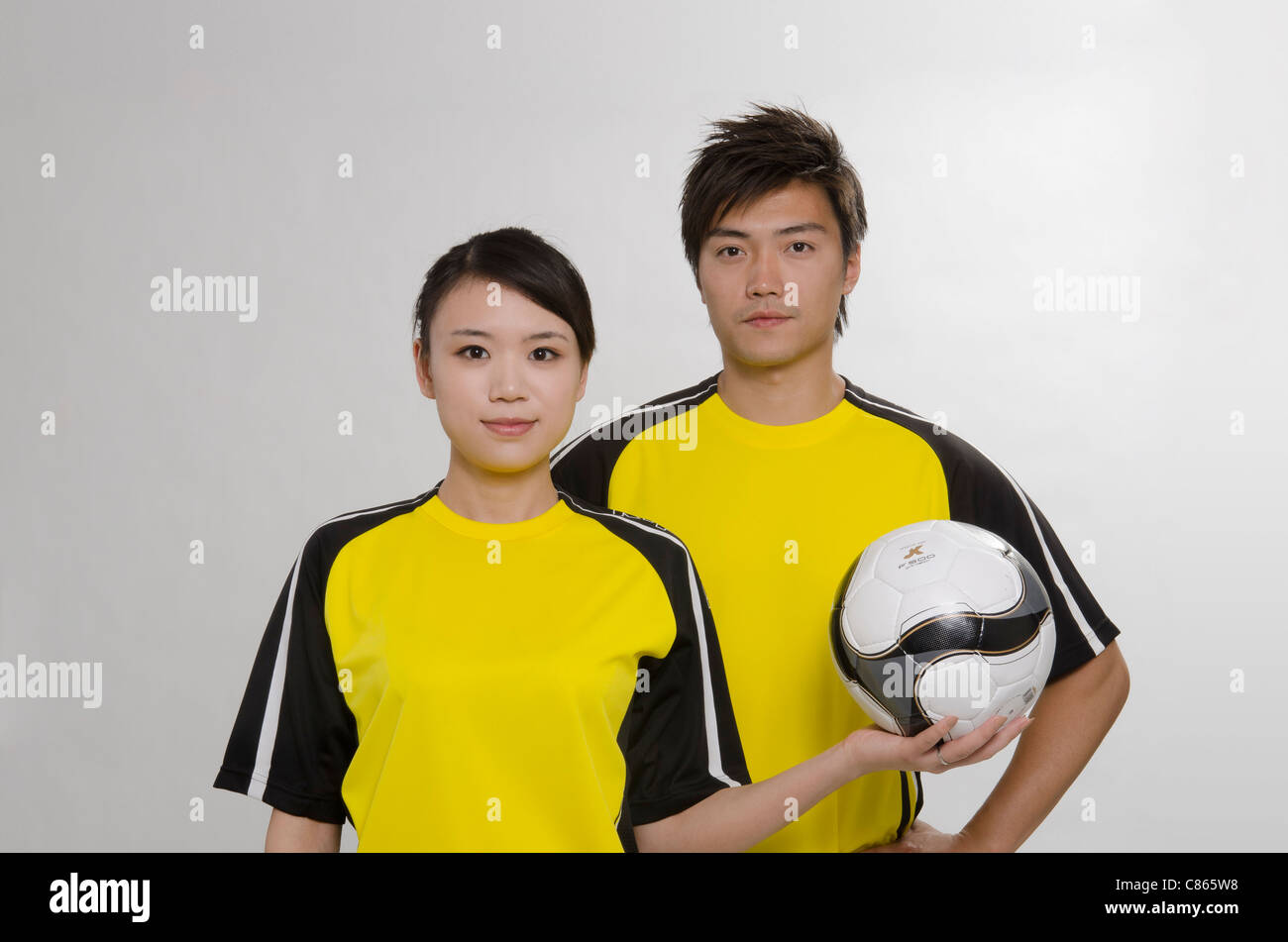 a young couple football player Stock Photo - Alamy