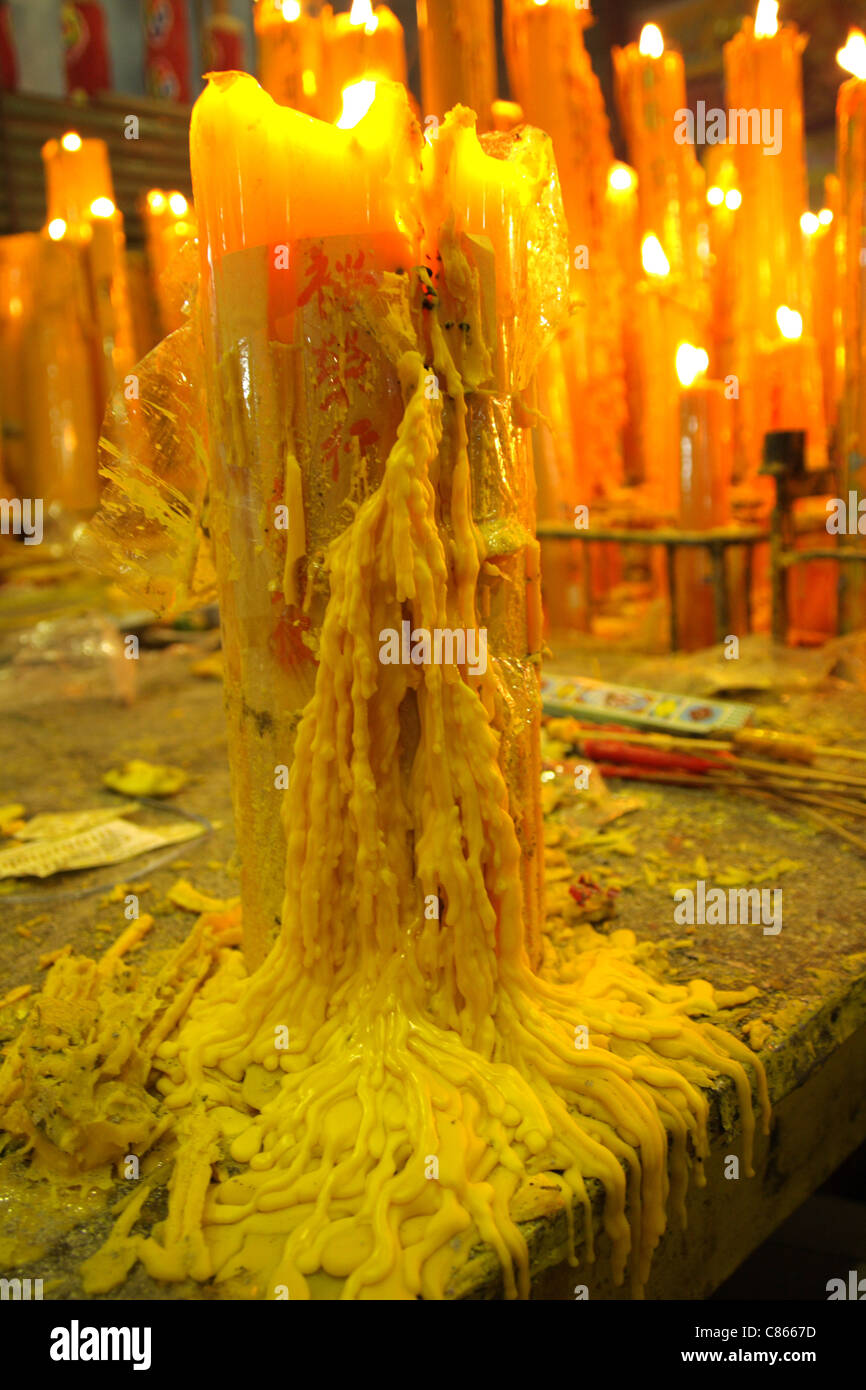 Giant candle burning on table Stock Photo - Alamy