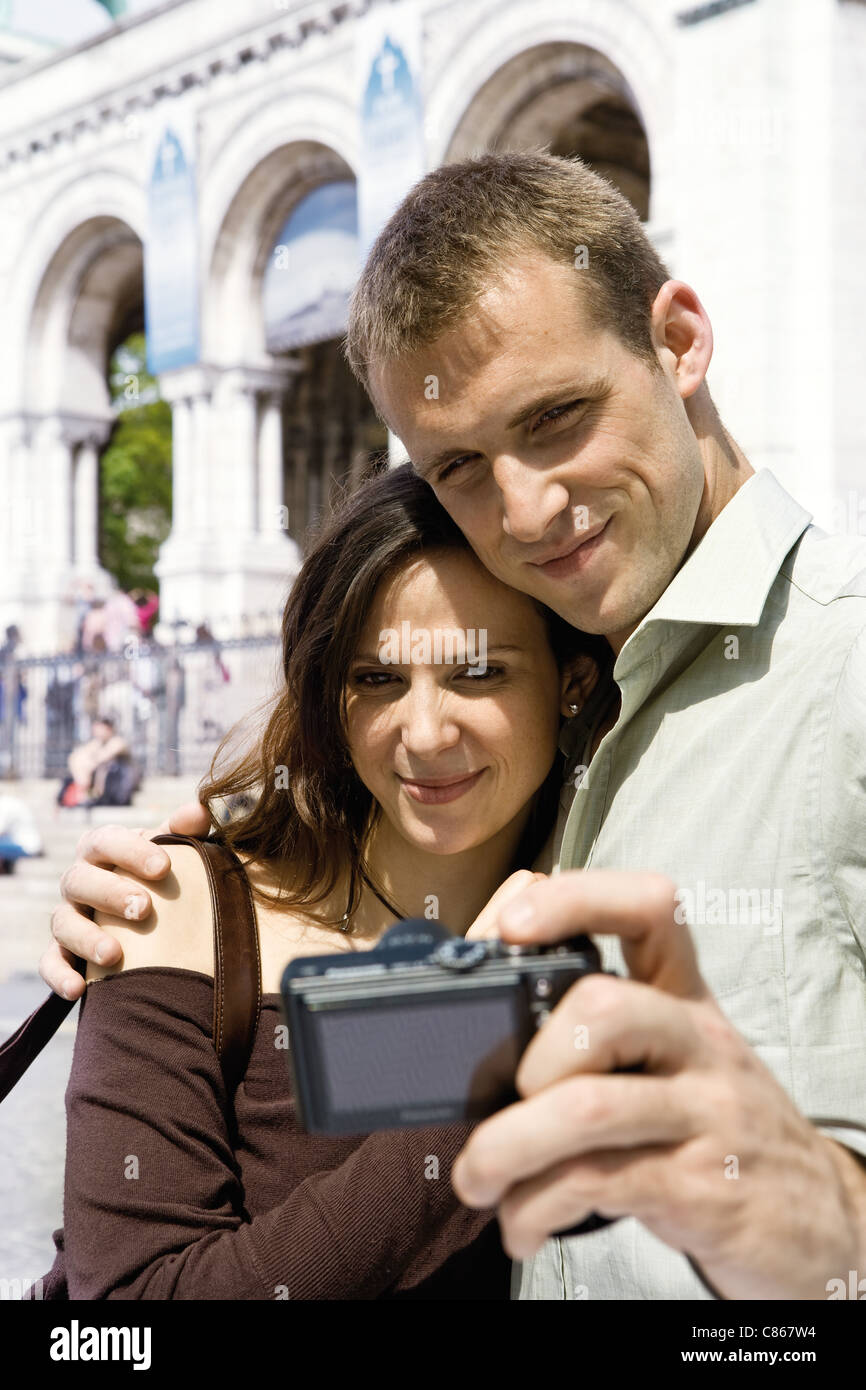 Man photographing himself and his girlfriend with digital camera Stock ...