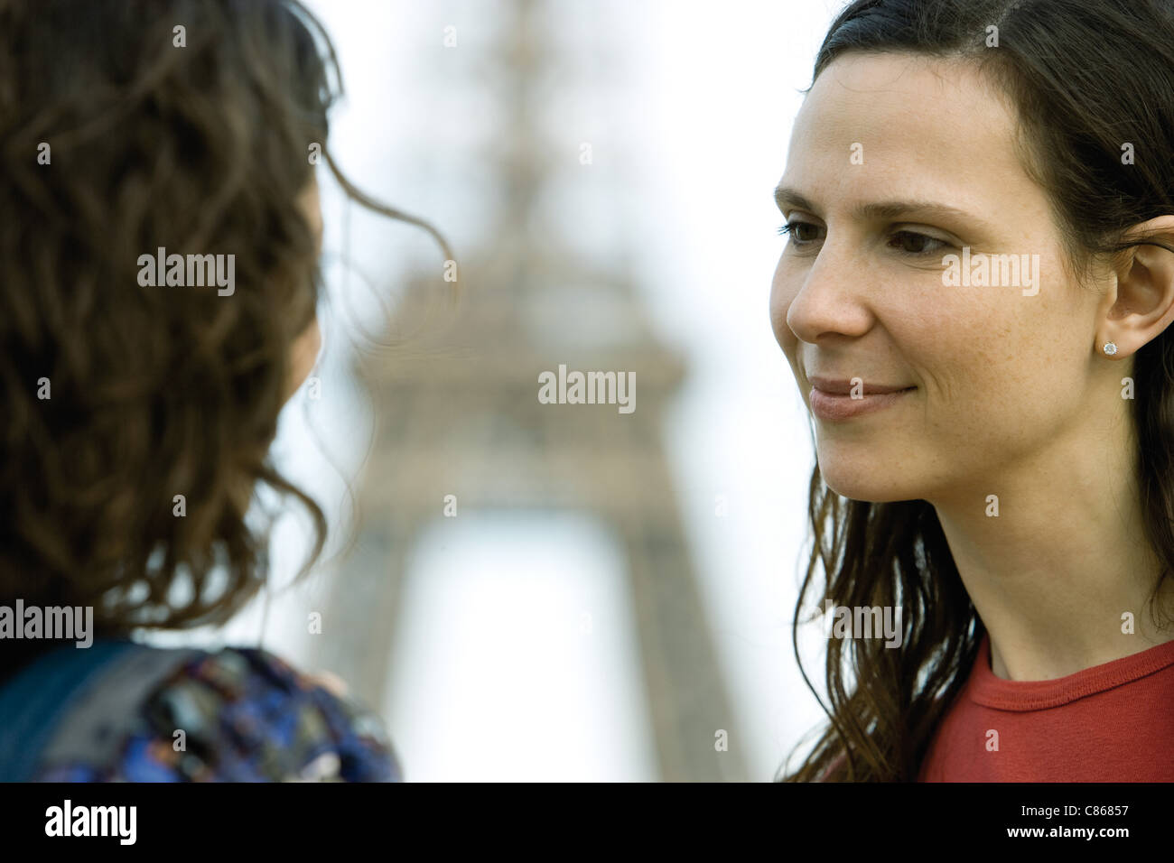 Woman talking with friend outdoors Stock Photo - Alamy