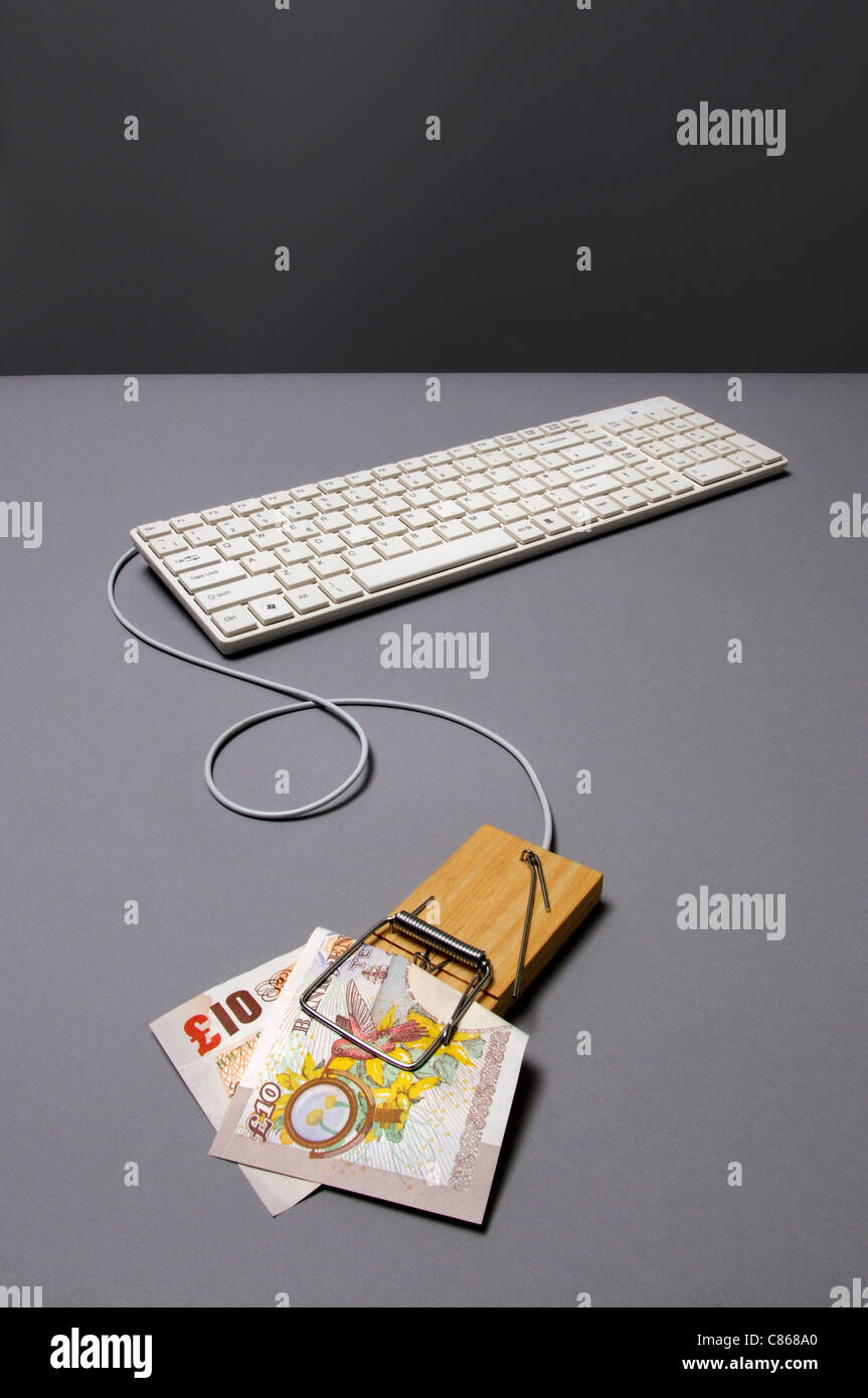 British pound banknote in mousetrap connected to keyboard Stock Photo ...