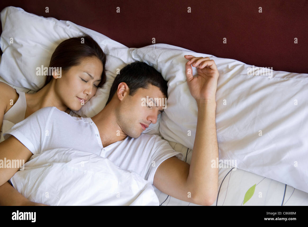 Couple spooning in bed hi-res stock photography and images - Alamy