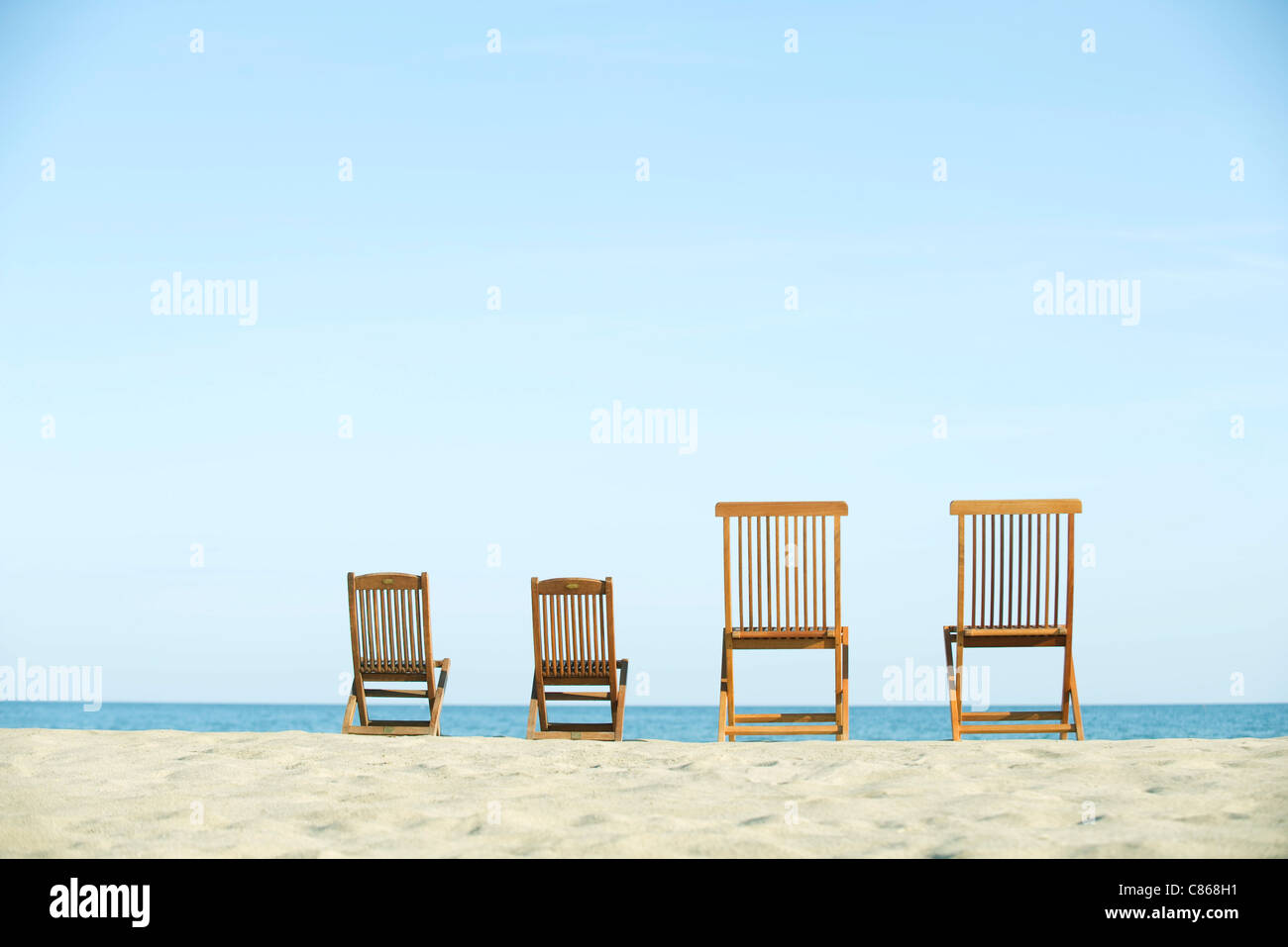 Lounge chairs on beach Stock Photo - Alamy