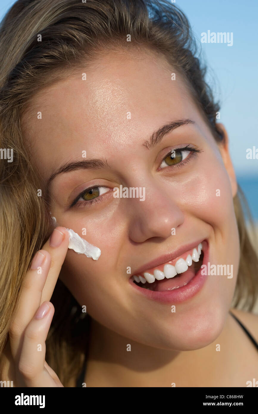 Cropped applying sunscreen hi-res stock photography and images - Alamy