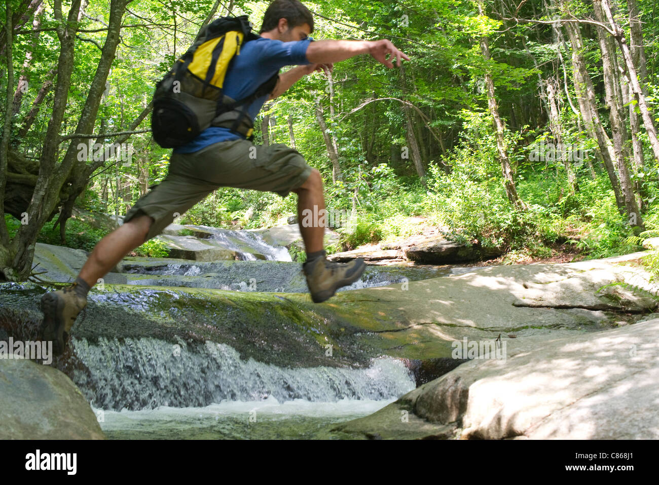 Man jumping over stream through hi-res stock photography and images - Alamy