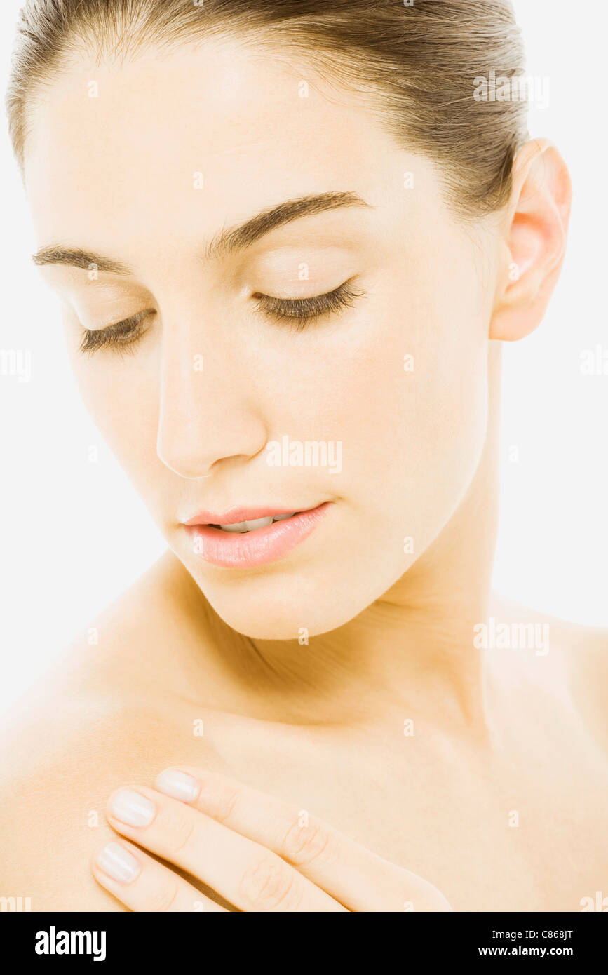 Woman touching bare shoulder, portrait Stock Photo - Alamy