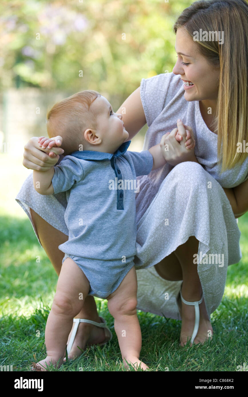 Mother and baby bonding outdoors Stock Photo - Alamy