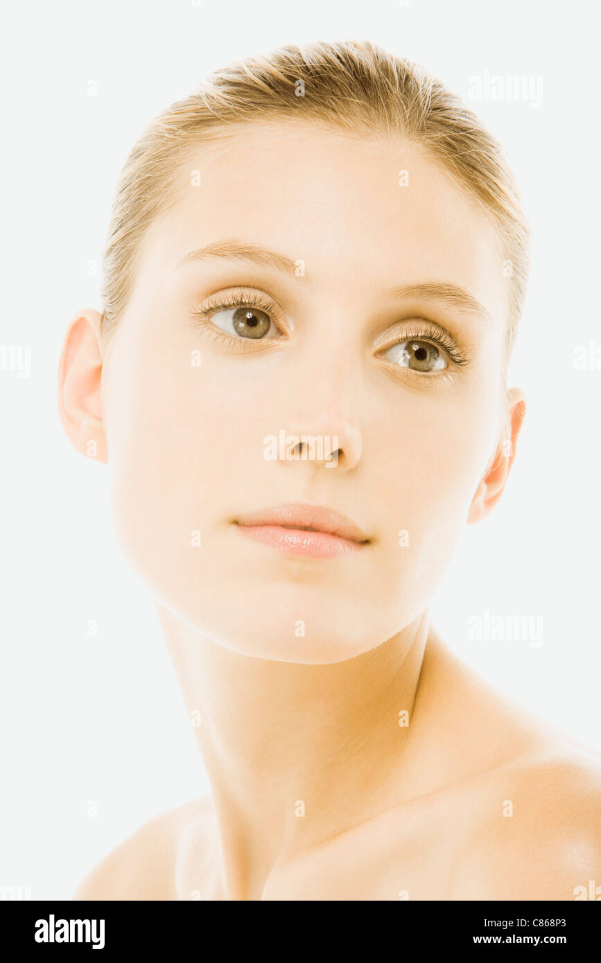 Young woman with bare shoulders, tilting head, portrait Stock Photo - Alamy