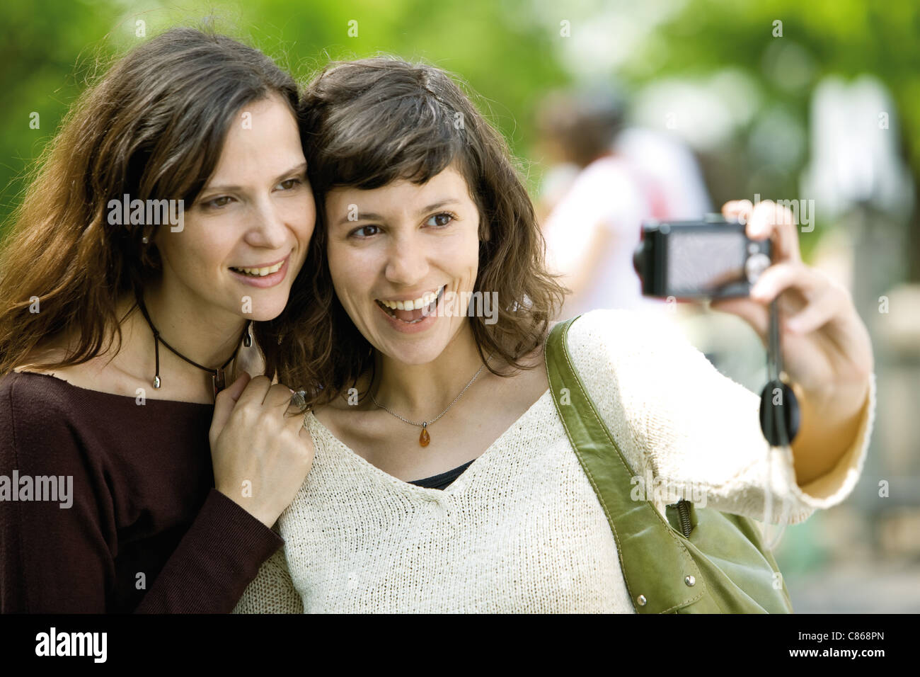 Woman photographing herself with friend Stock Photo - Alamy
