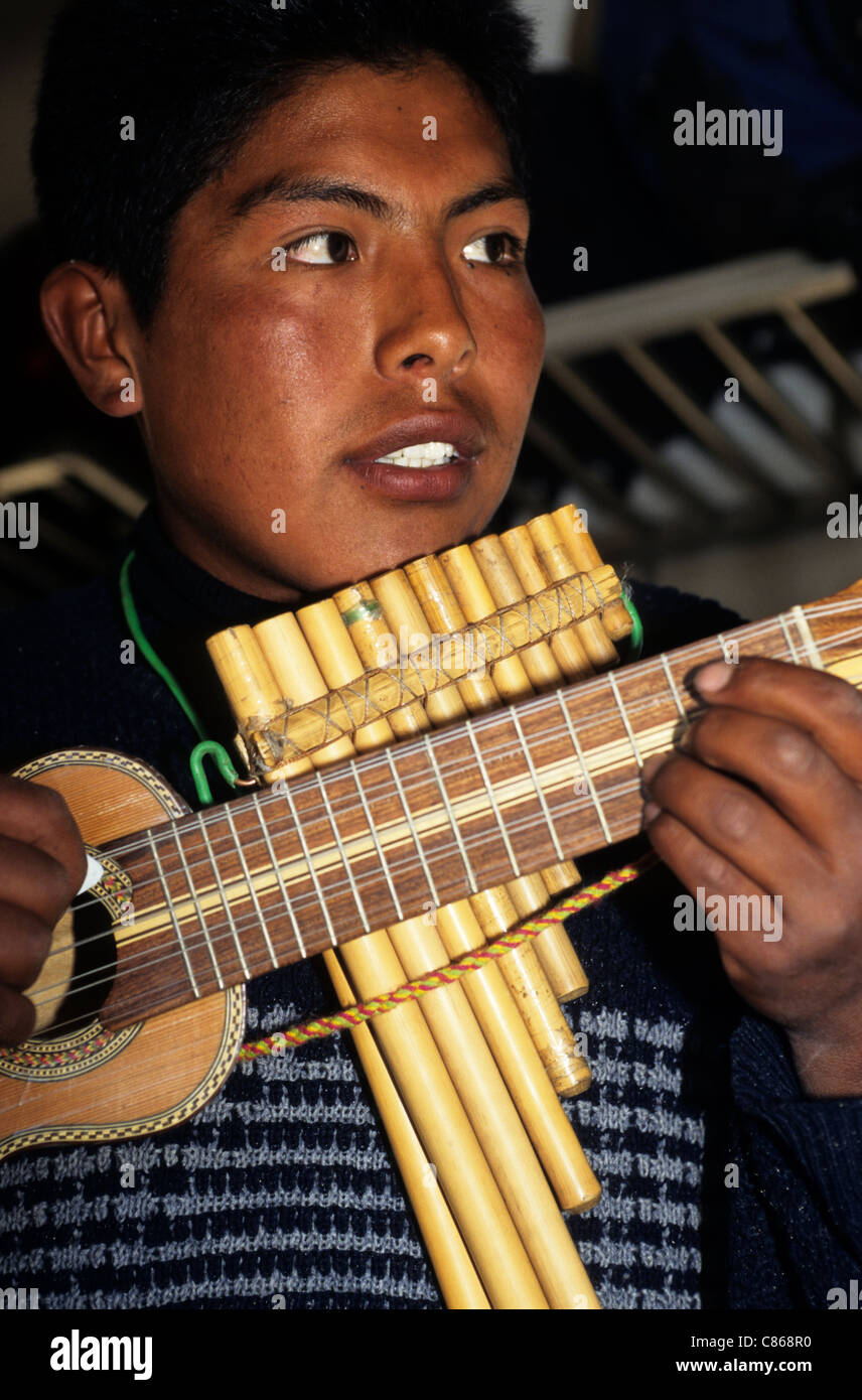 Peru. Musician playing the charango and the panpipes on the train from ...