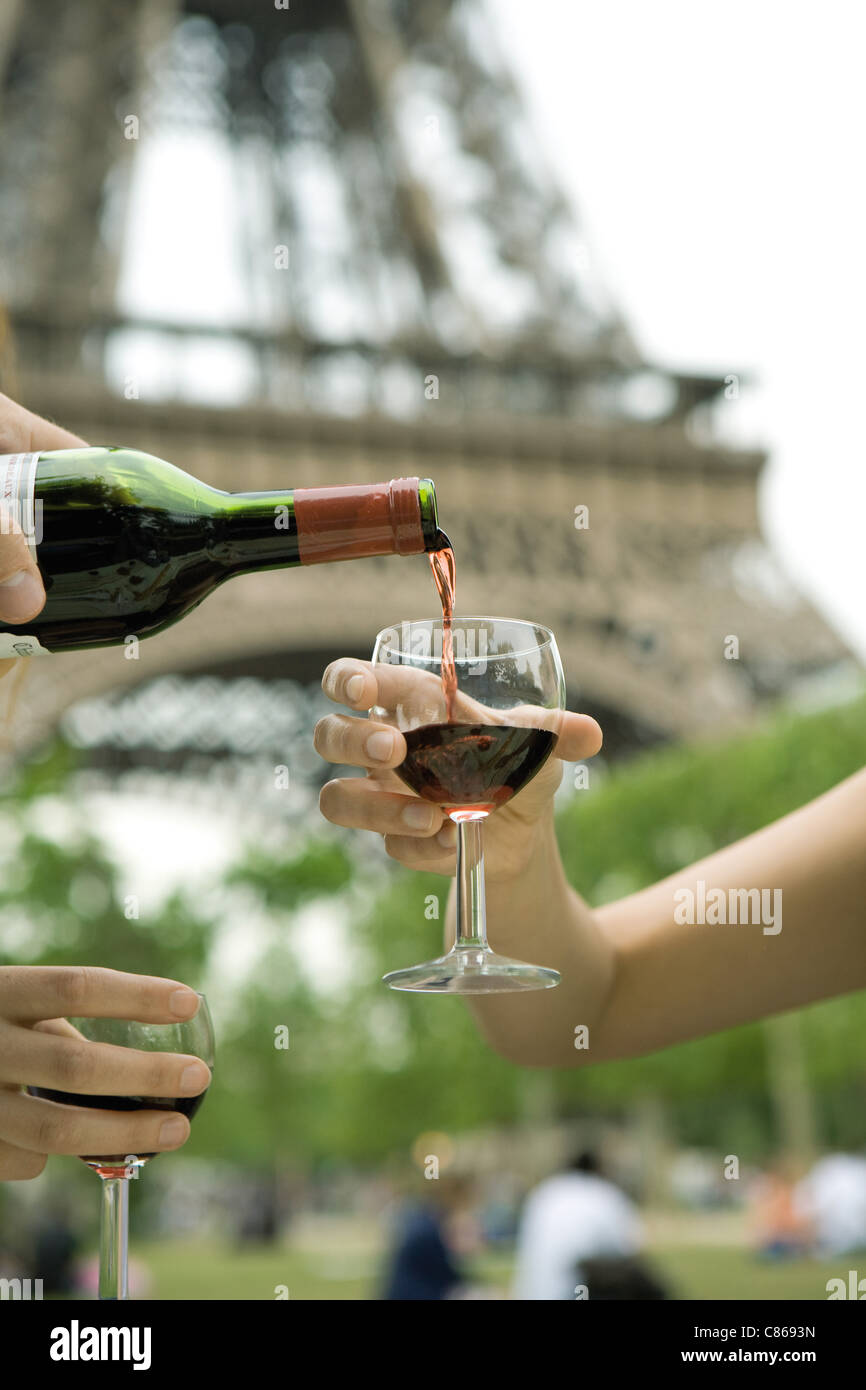 Pouring glass of red wine outdoors Stock Photo - Alamy