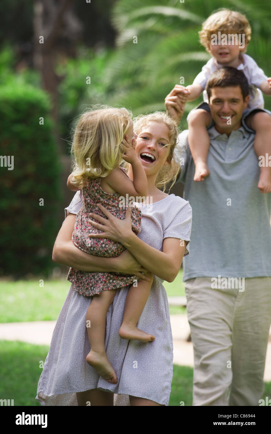 Parents carrying children outdoors Stock Photo - Alamy