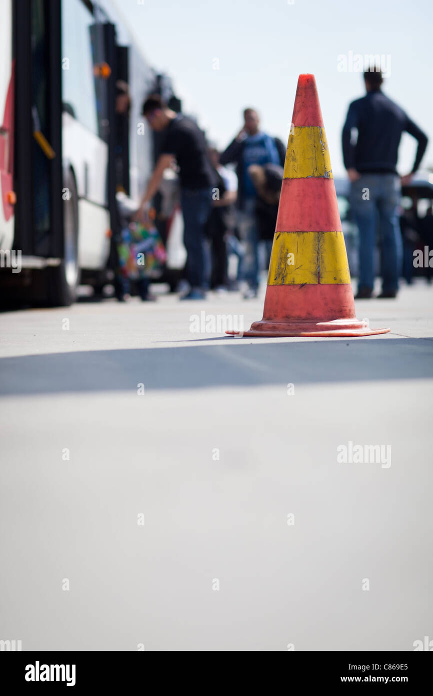 Safety cone at the aerodrome of an airport (with passengers getting on ...