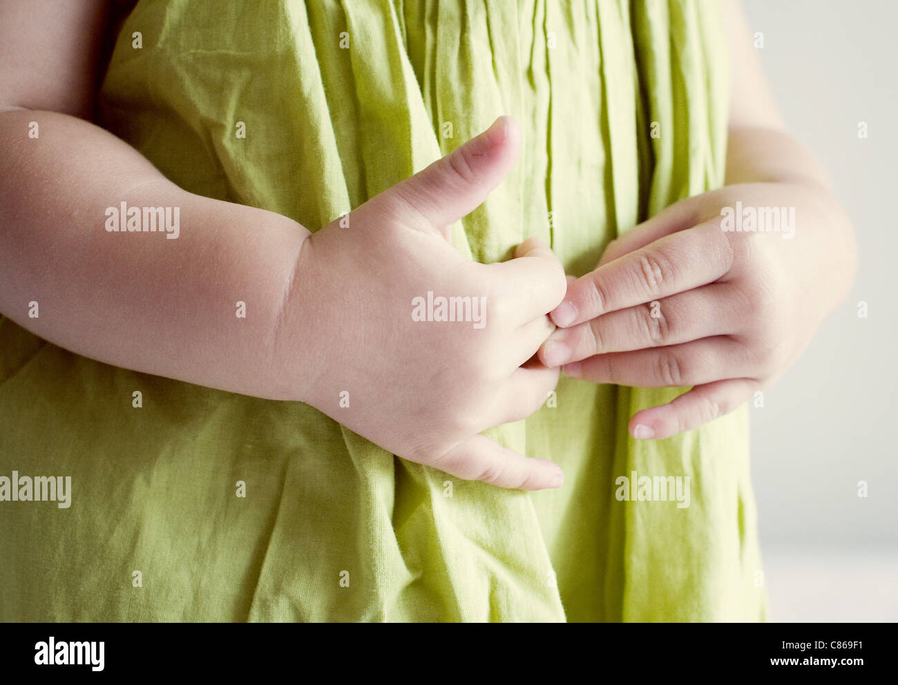 Child putting hands on stomach Stock Photo - Alamy