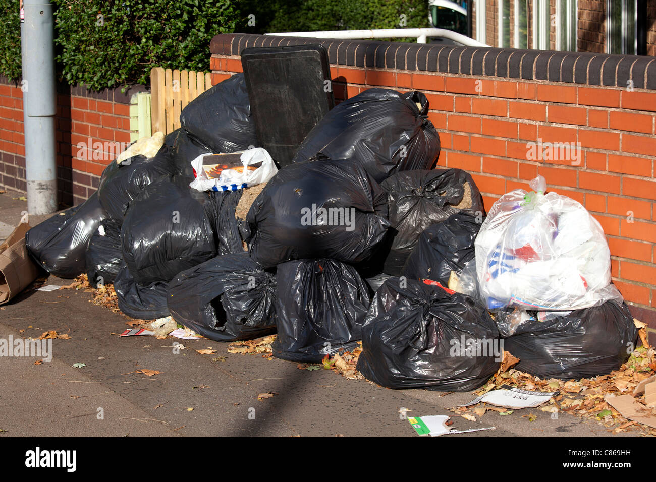 Rubbish, piled on the pavement in Victoria Road, Aston, Birmingham ...