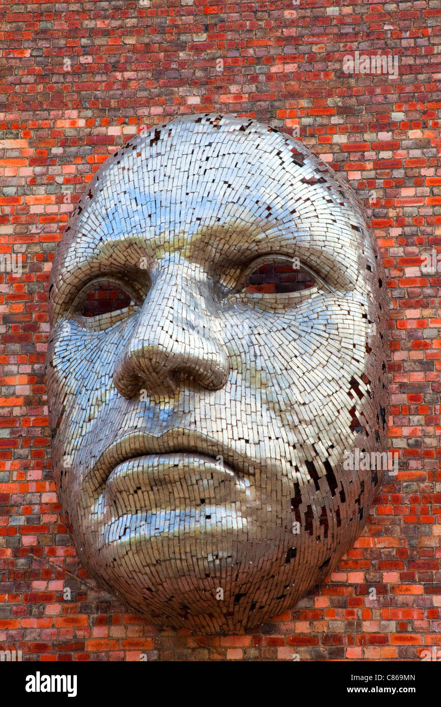 Metal face sculpture on outside wall of Lincoln City Drill Hall, by ...