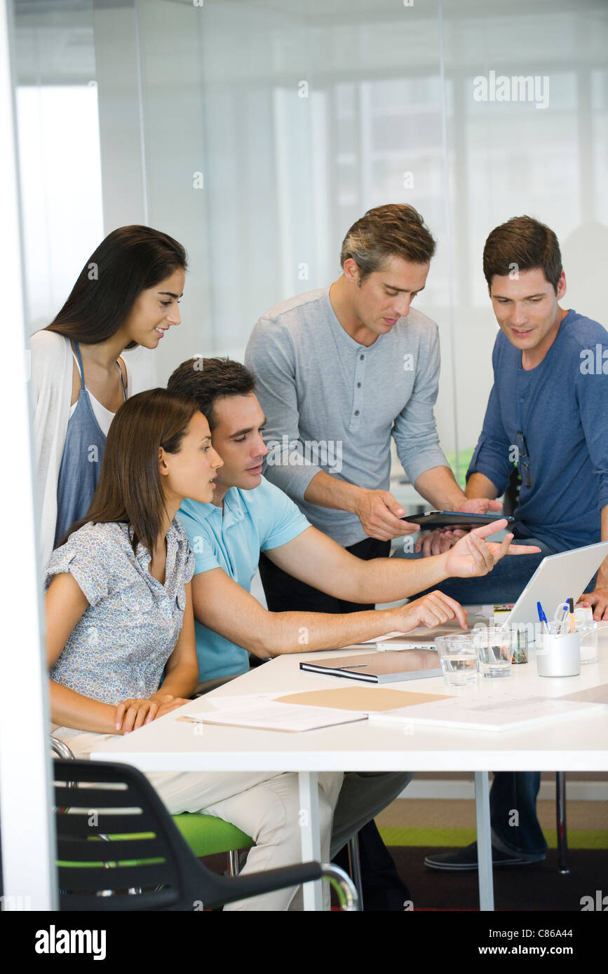 Business associates collaborating in office Stock Photo - Alamy