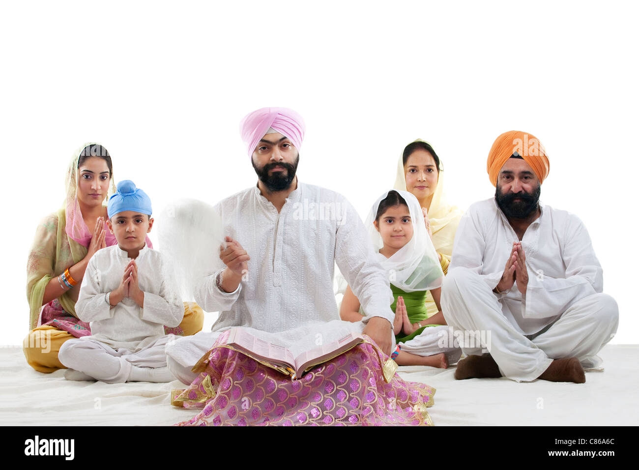 Sikh family praying Stock Photo - Alamy