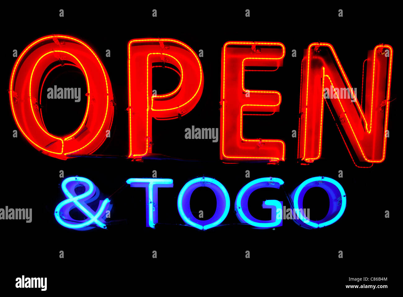 Open and To Go neon sign isolated on black background Stock Photo - Alamy