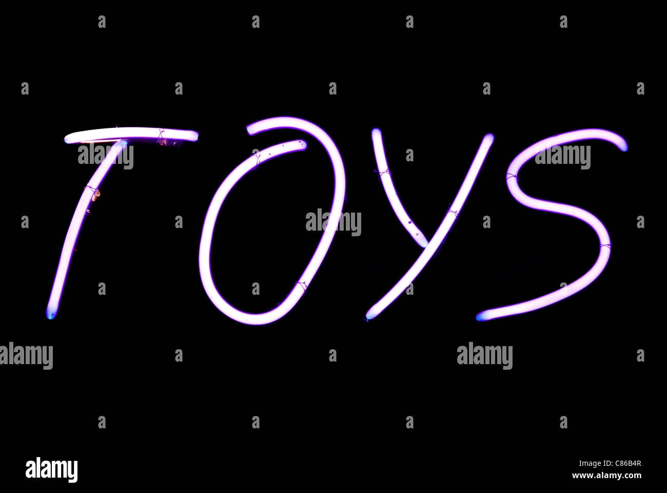 Toys neon sign isolated on black background Stock Photo - Alamy