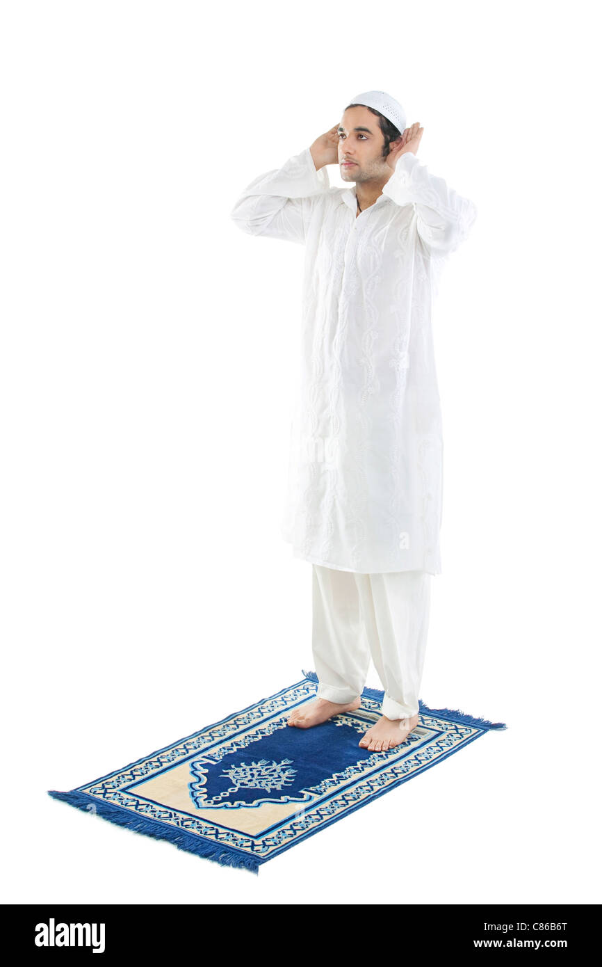 Muslim man standing praying hi-res stock photography and images - Alamy