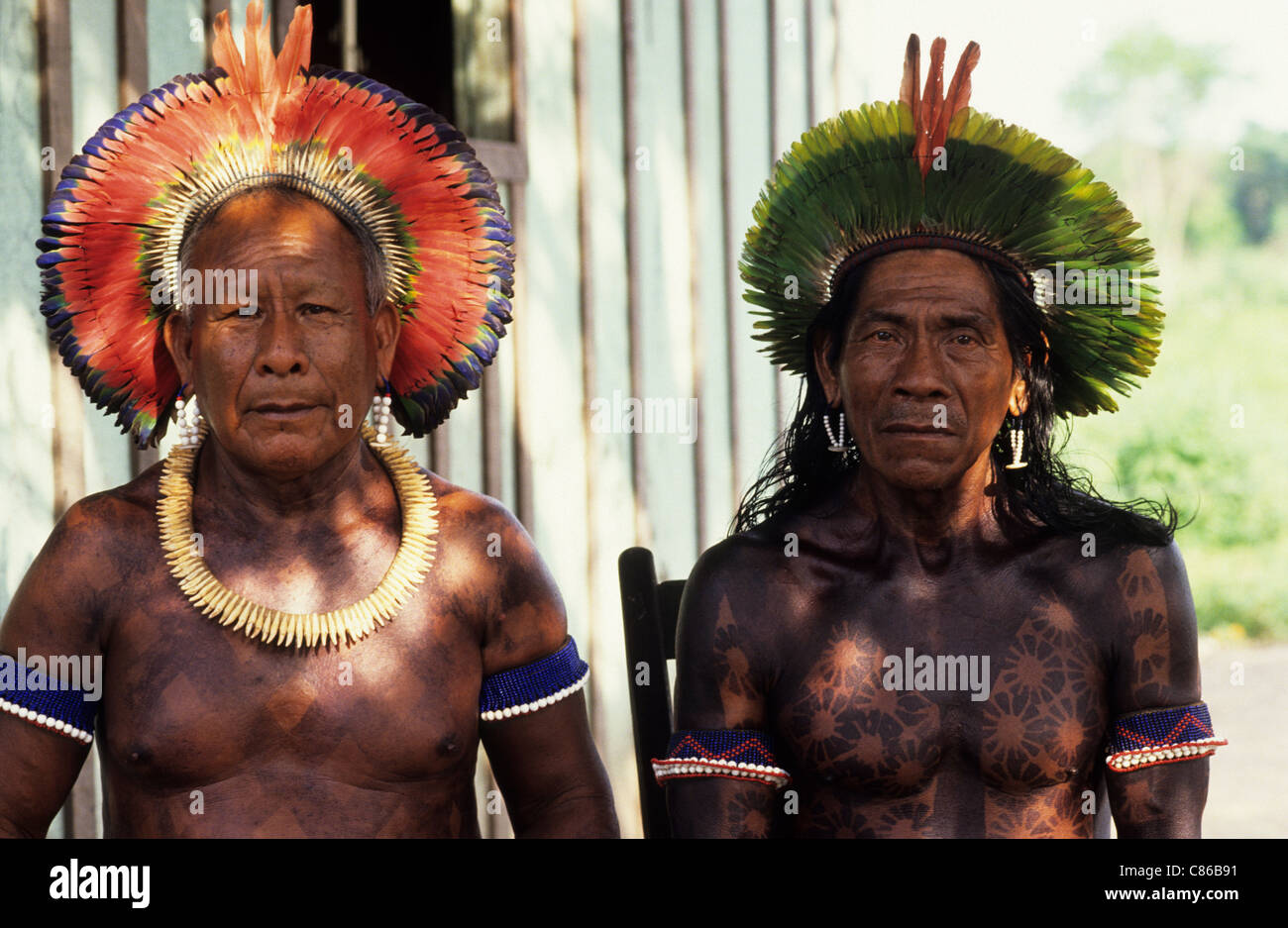 Altamira, Brazil. Two Kayapo Indian elders with bead amulets and tooth ...