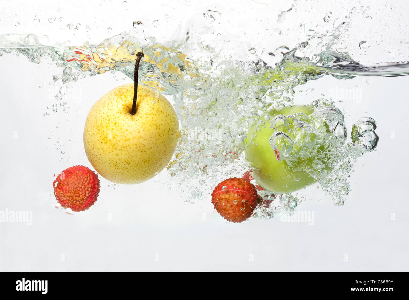Fruit Splashing in Water Stock Photo - Alamy