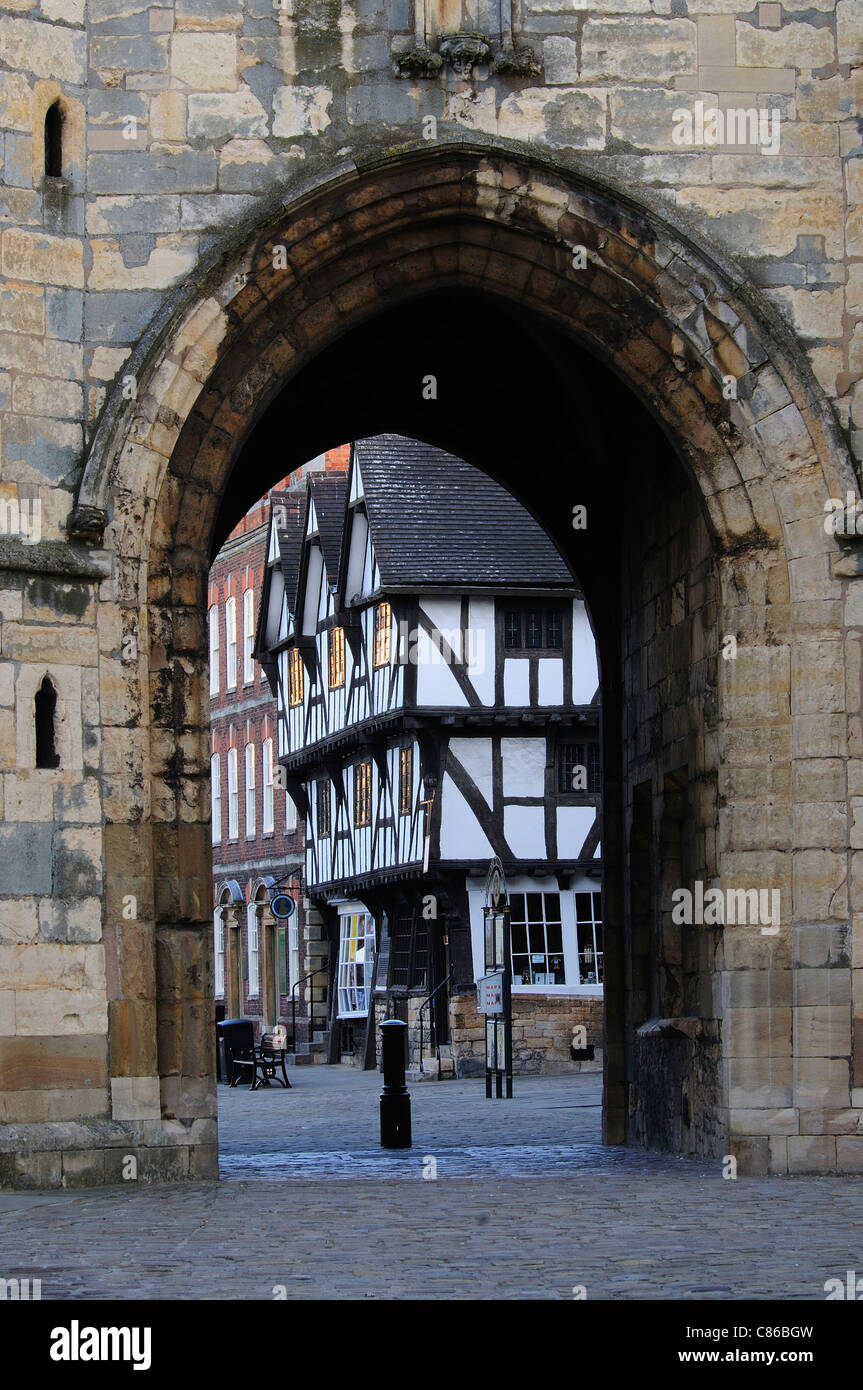 A view of a timbered building in the city of Lincoln through a medieval ...