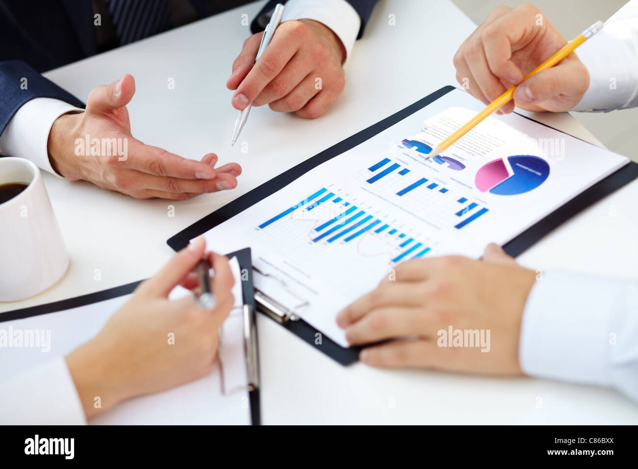 Hands of business people over documents Stock Photo - Alamy