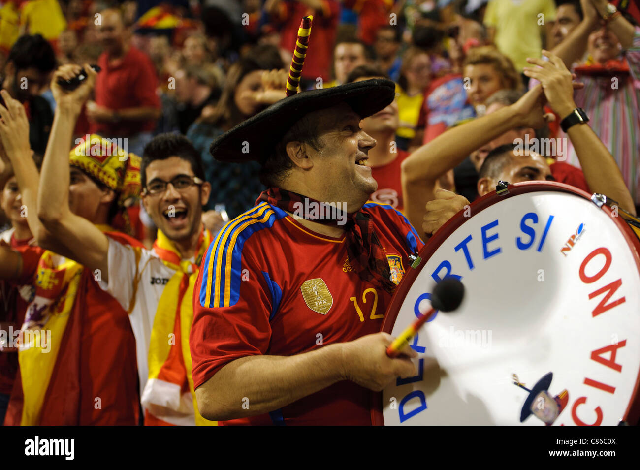 Spain fan Manolo plays his drum with the fans Stock Photo - Alamy