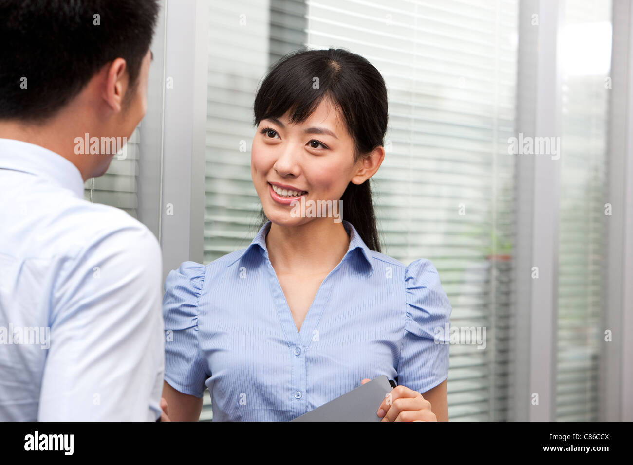 Colleagues Talking Together Stock Photo - Alamy