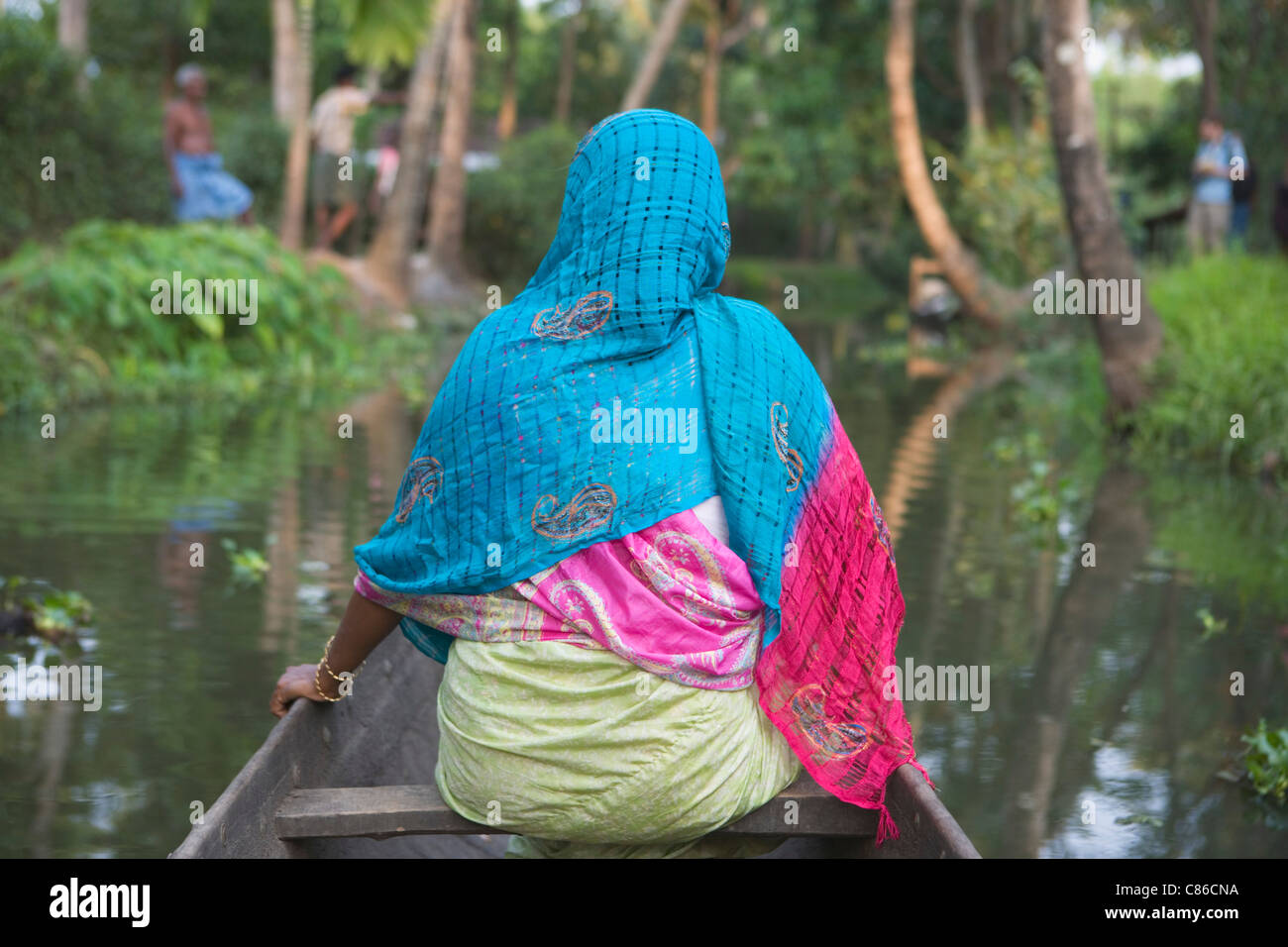 BACKWATERS: WOMAN IN SARI ON BOAT Stock Photo - Alamy