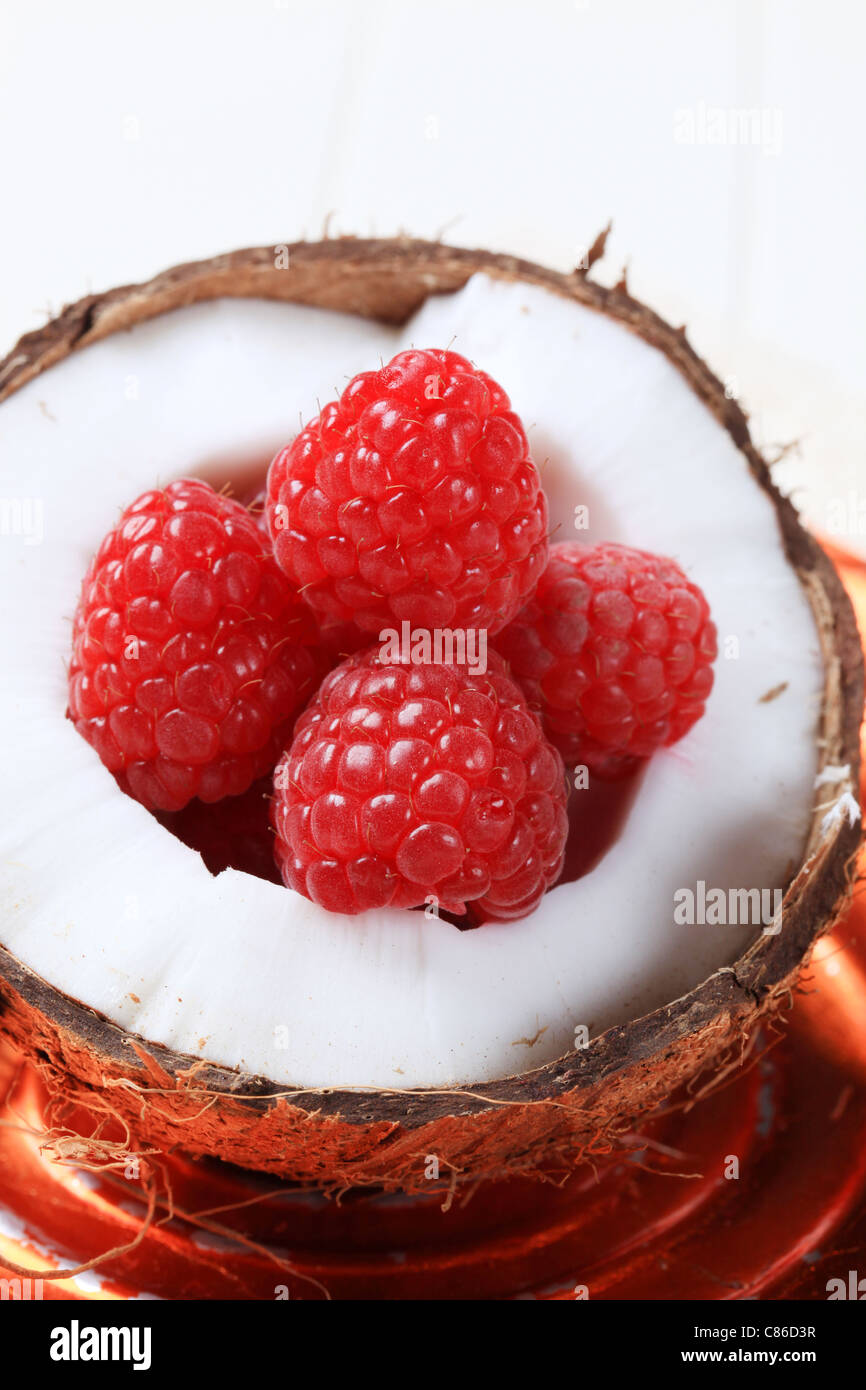 Fresh raspberries in a coconut shell - detail Stock Photo - Alamy