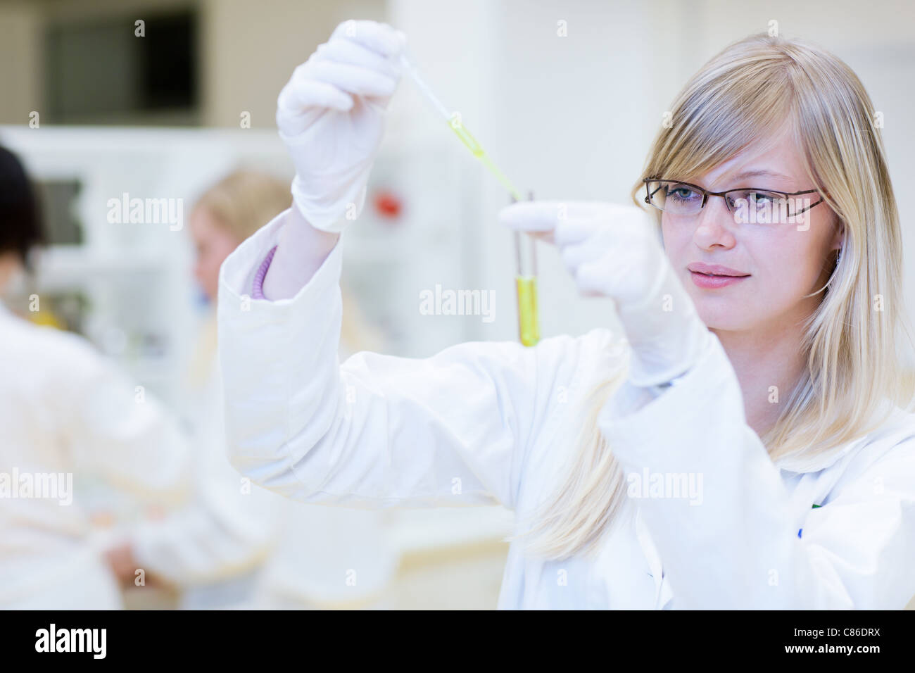 Portrait of a female researcher in a chemistry lab/laboratory (color ...