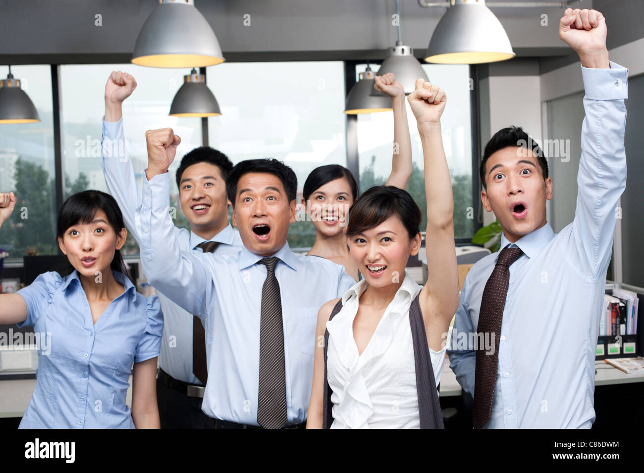 Colleagues Cheering Together Stock Photo - Alamy