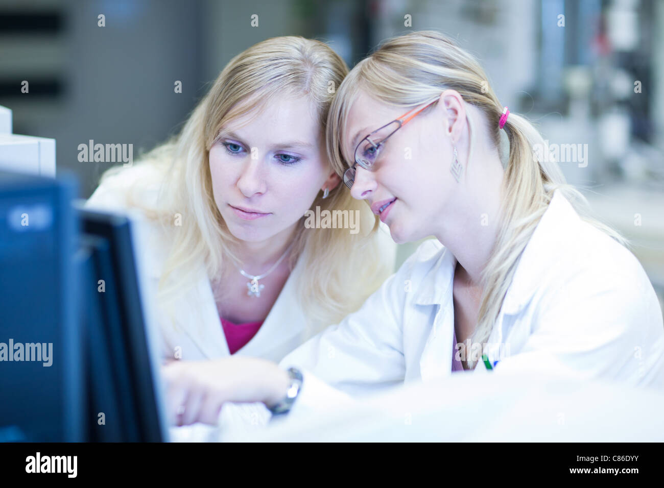 Female lab worker mixing medical hi-res stock photography and images ...
