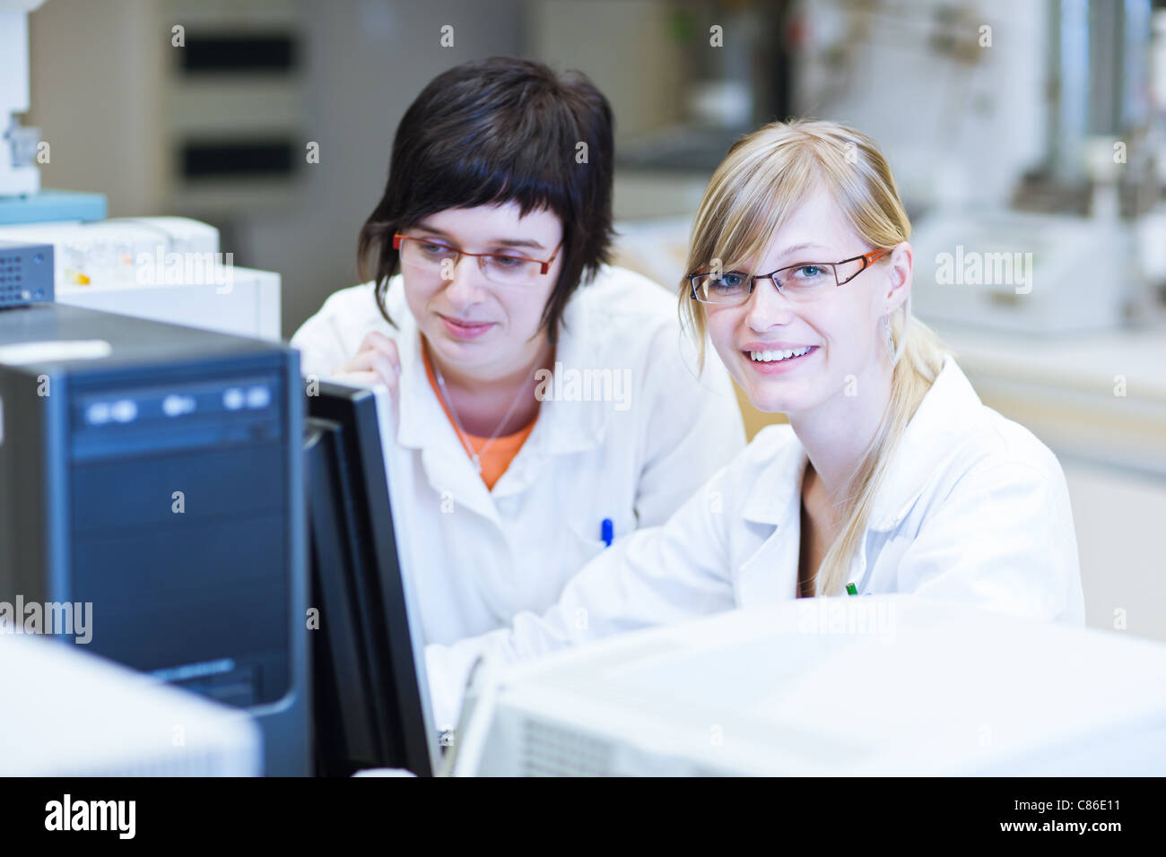 Female lab worker mixing medical hi-res stock photography and images ...