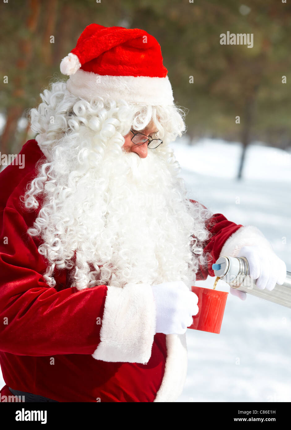 Santa Claus drinking hot tea in winter forest Stock Photo - Alamy