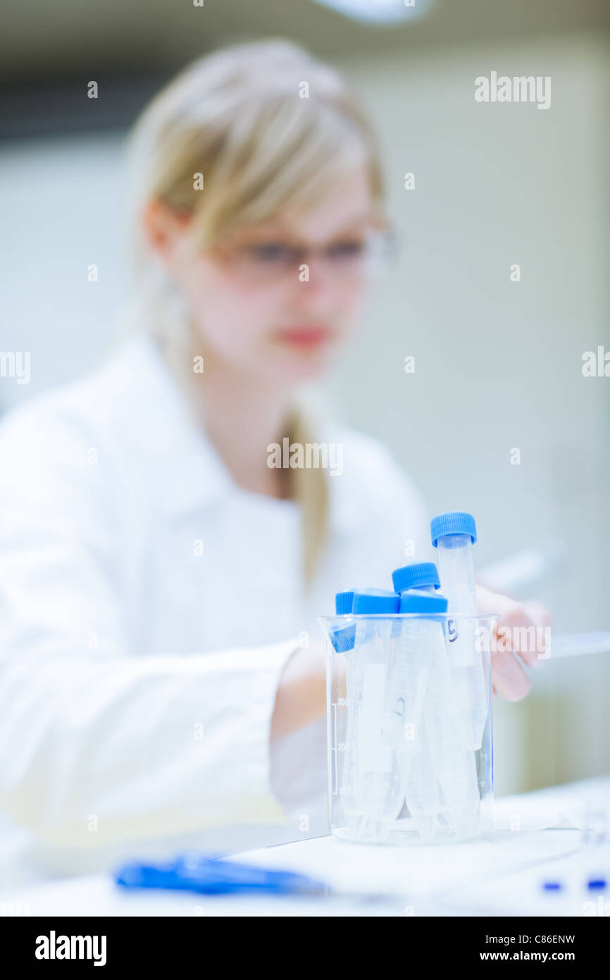 Portrait of a female researcher in a chemistry lab/laboratory (color ...