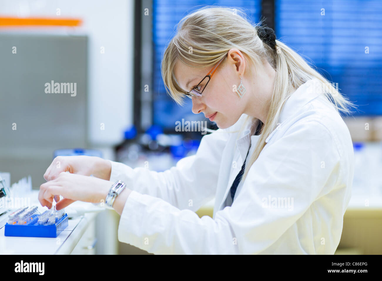Portrait of a female researcher in a chemistry lab/laboratory (color ...
