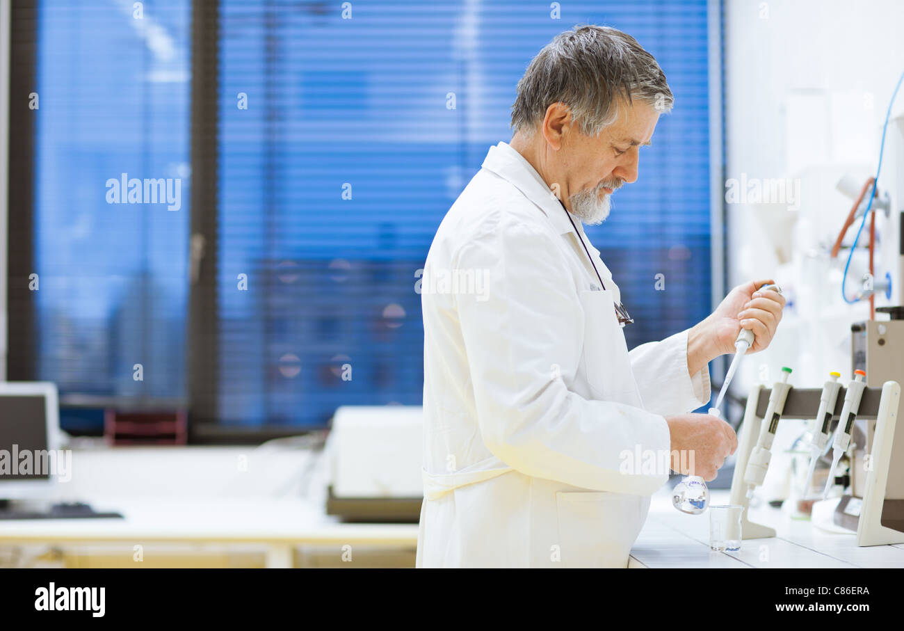 Senior scientist doing research in a laboratory Stock Photo - Alamy