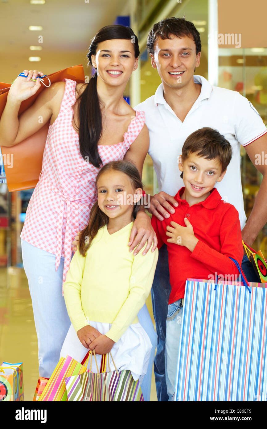 Portrait of happy parents and children during shopping Stock Photo - Alamy