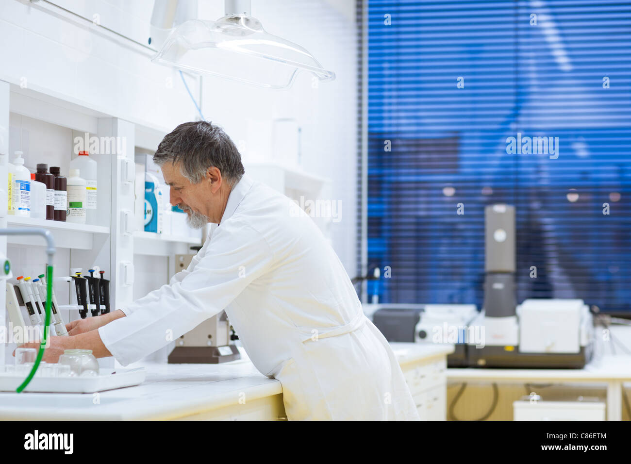 Senior scientist doing research in a laboratory Stock Photo - Alamy