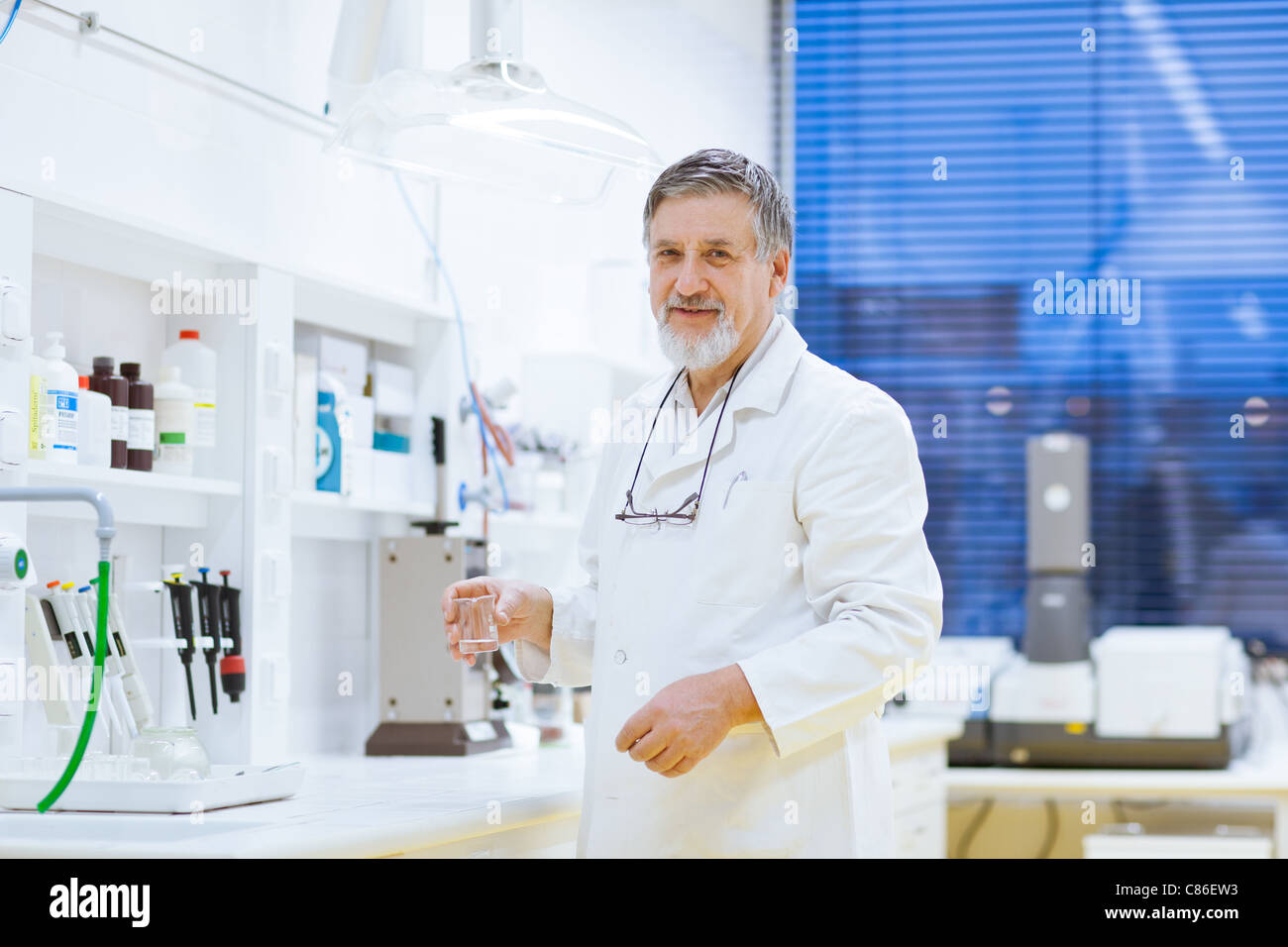 Portrait of a senior scientist doing research in a laboratory Stock ...