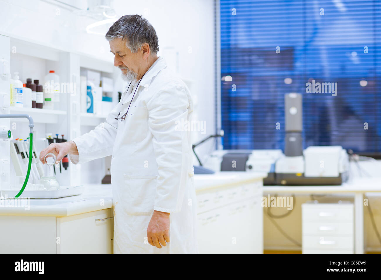 Senior scientist doing research in a laboratory Stock Photo - Alamy