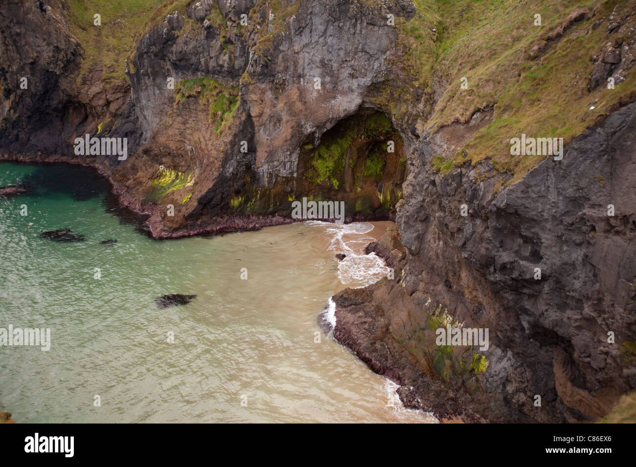 Land eroded cave by the sea Stock Photo - Alamy